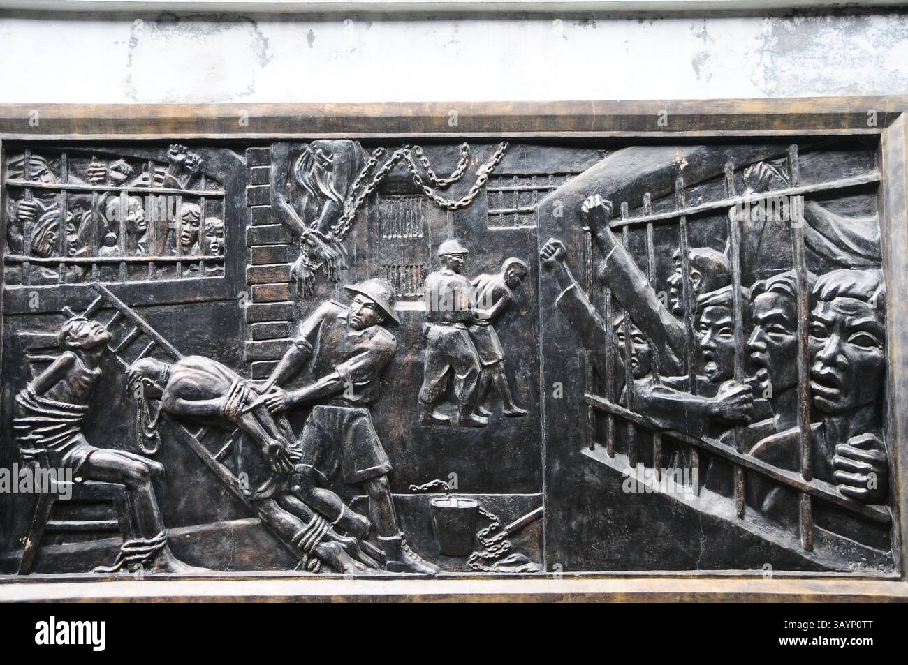 Bas-relief image of Vietnamese prisoners being tortured by French ...