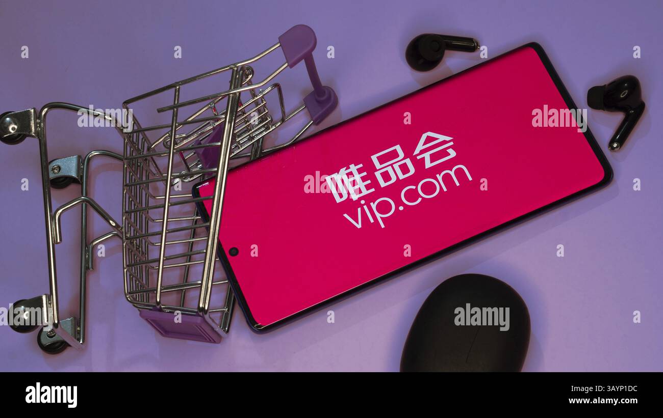 Dhaka, Bangladesh 19 April 2025: Person holding smartphone with logo of Chinese company Vipshop ...