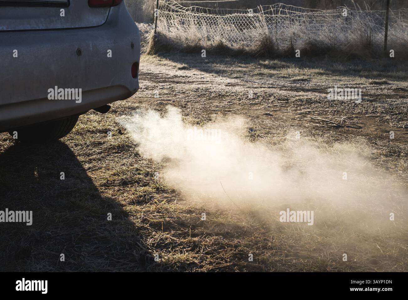 Exhaust fumes from a passenger car exhaust pipe Stock Photo - Alamy