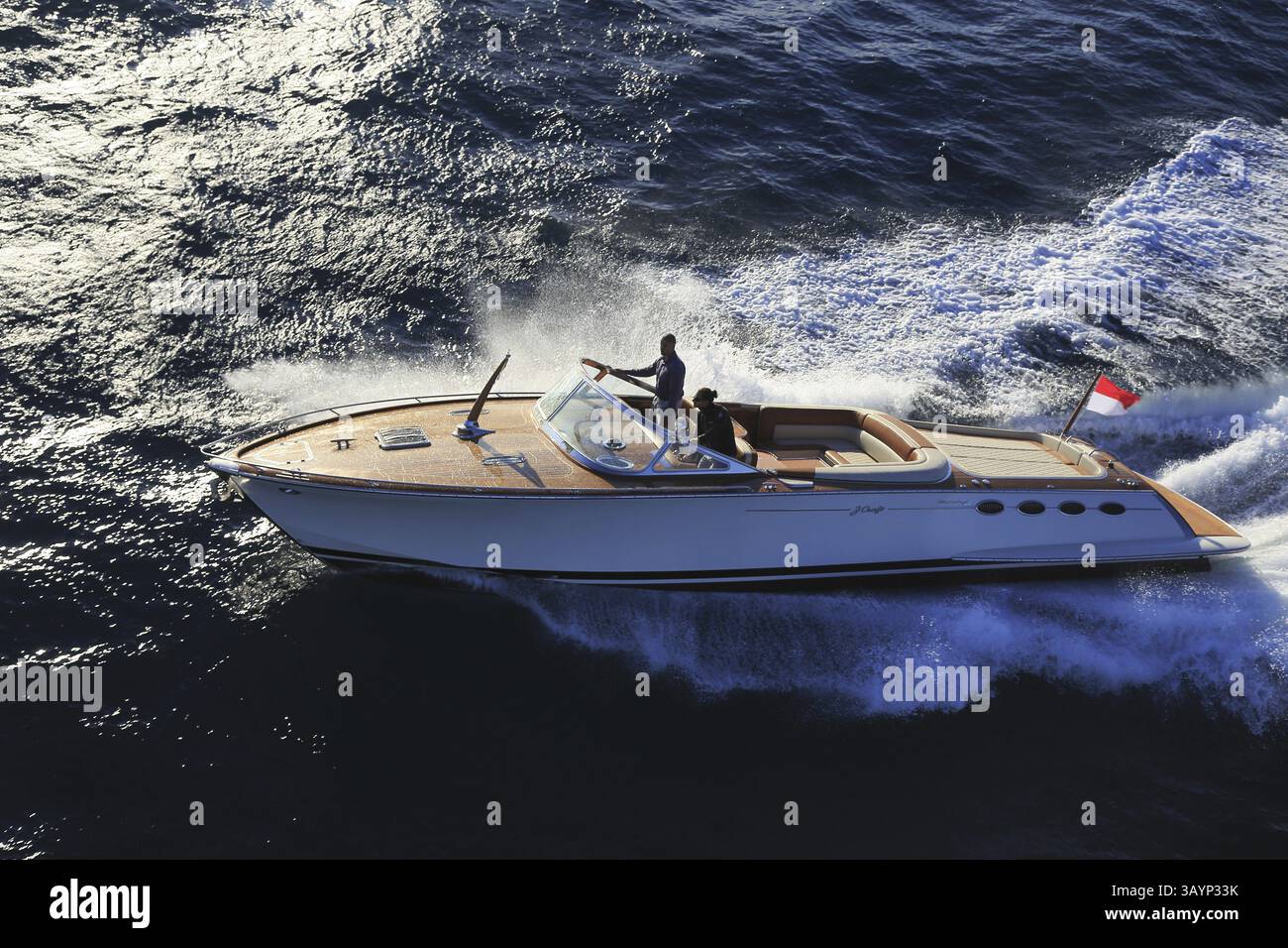 Aerial view sports boat J Craft 42 Torpedo R at full speed on the Cote ...