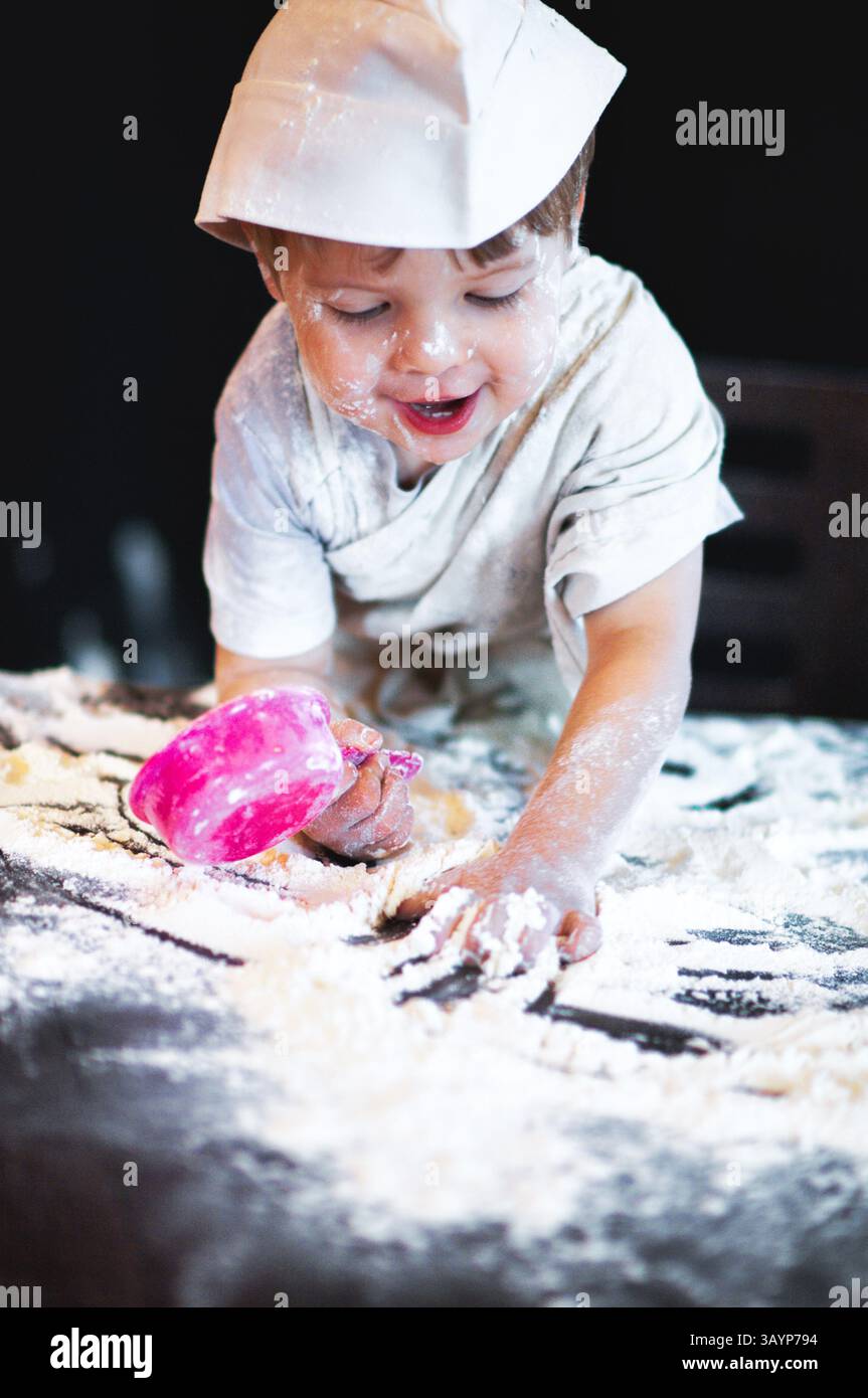 Child kneads flour on hi-res stock photography and images - Alamy