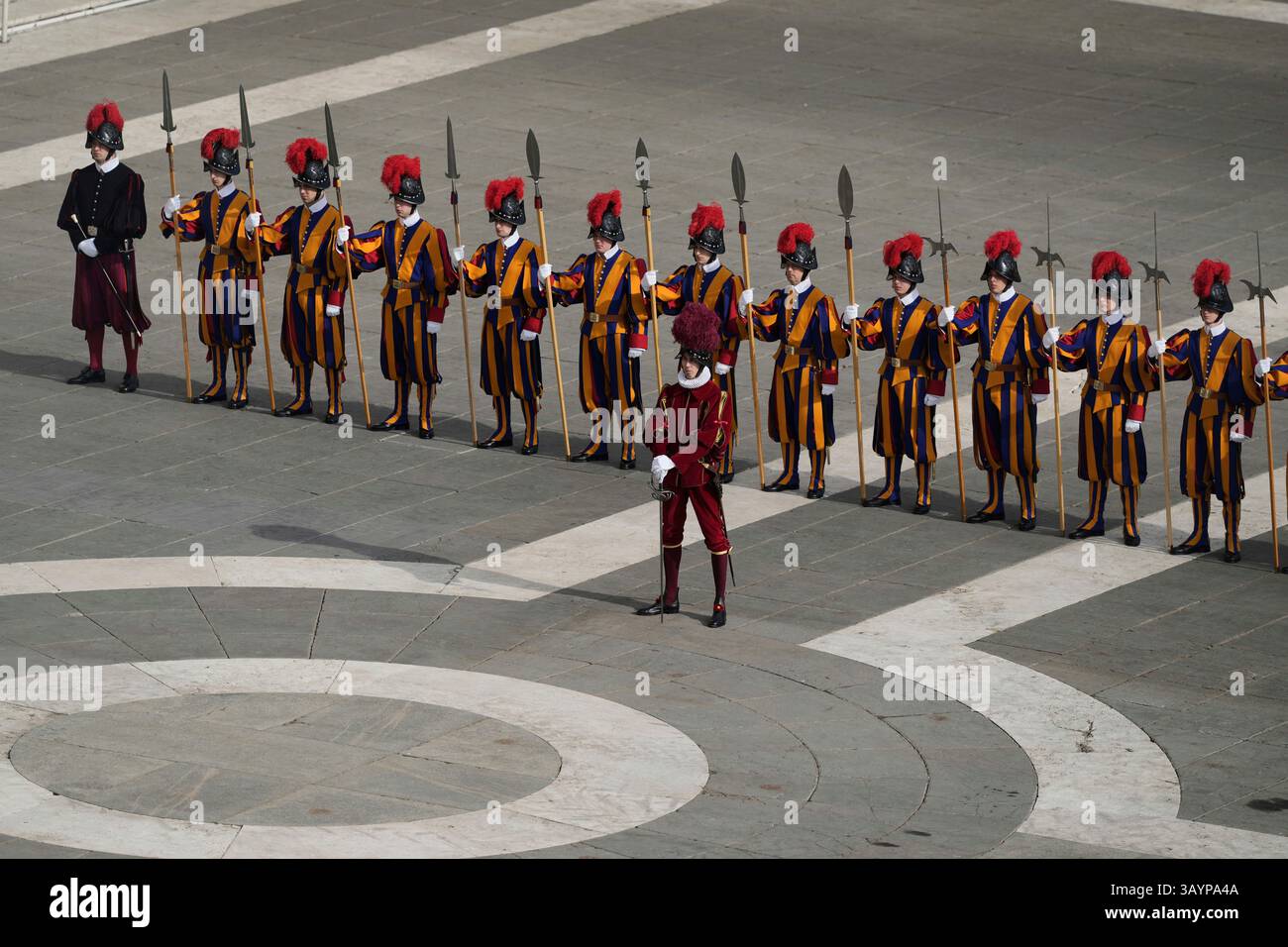Swiss guards stand in St. Peter's Square as they await the arrival of ...