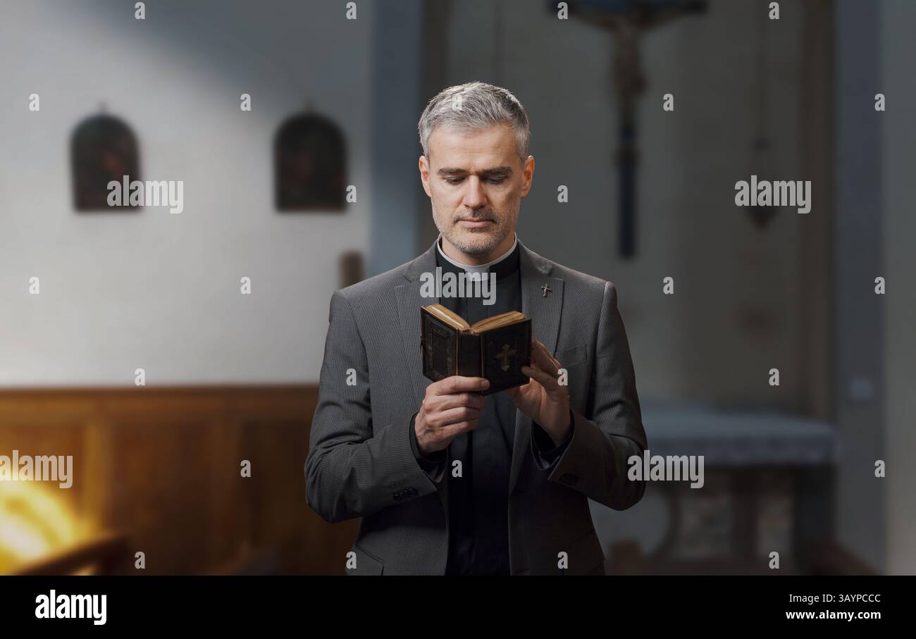 Portrait of a priest reading the gospel inside a church Stock Photo - Alamy