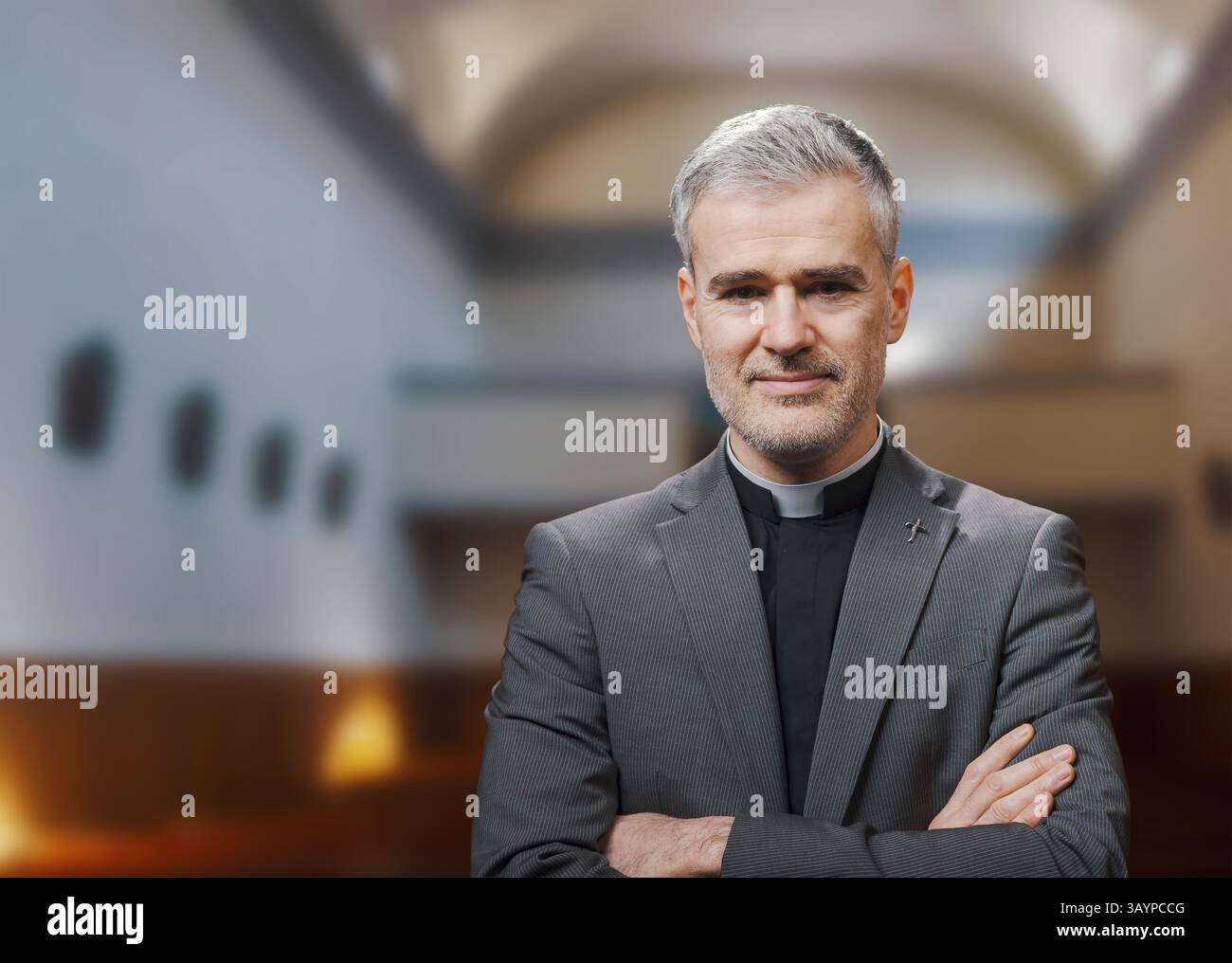 Portrait of a confident middleaged priest, dressed in clerical attire ...