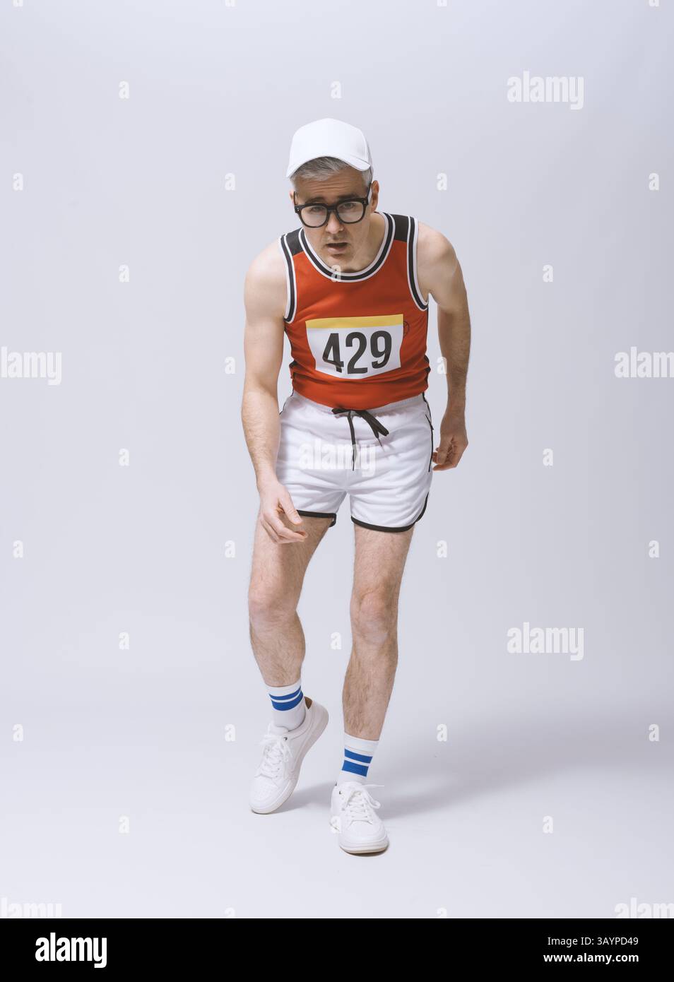 Weak athlete getting tired during a race, he is breathless and ...