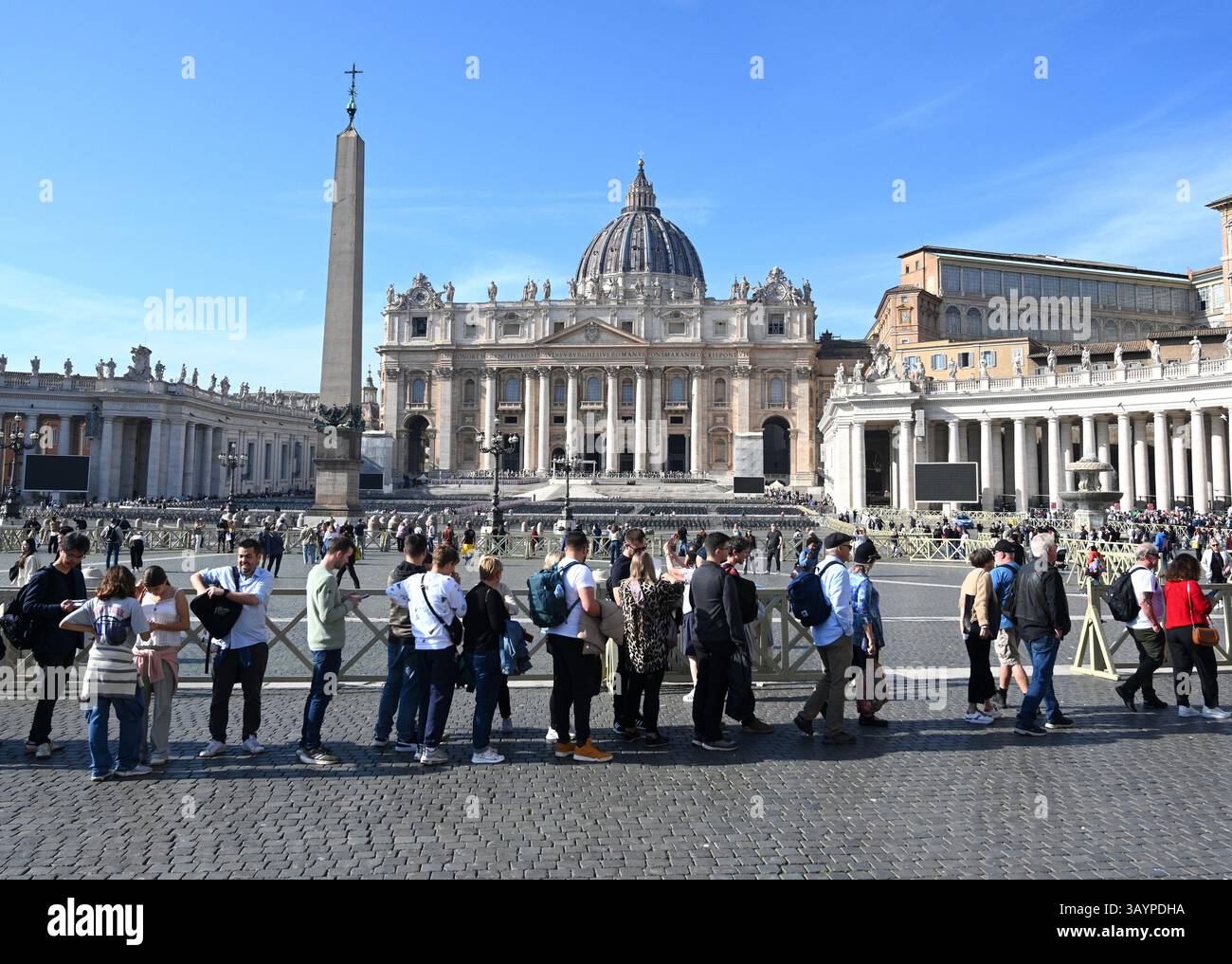 Vatican City - November 5, 2024: Tourists stand in a long line to the ...