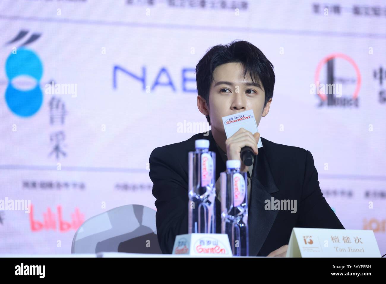 Chinese actor, singer, and dancer Tan Jianci attends an activity in ...