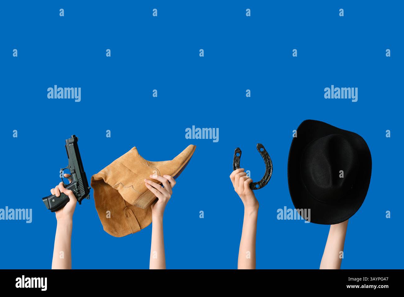 Female hands with cowboy hat, shoe, horseshoe and gun on blue ...