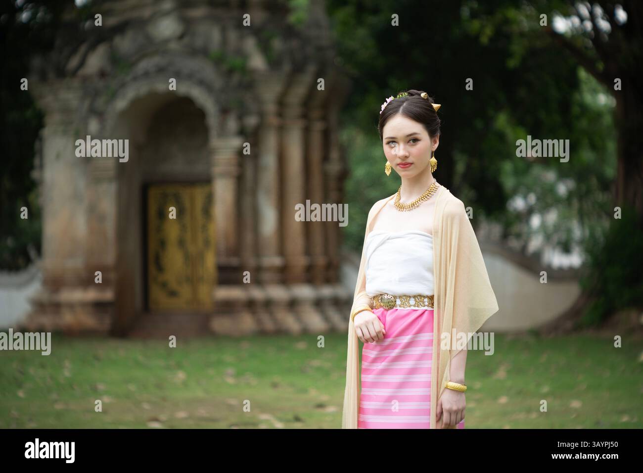 Beautiful young Asean woman in traditional Thai Dvaravati dress in an ...