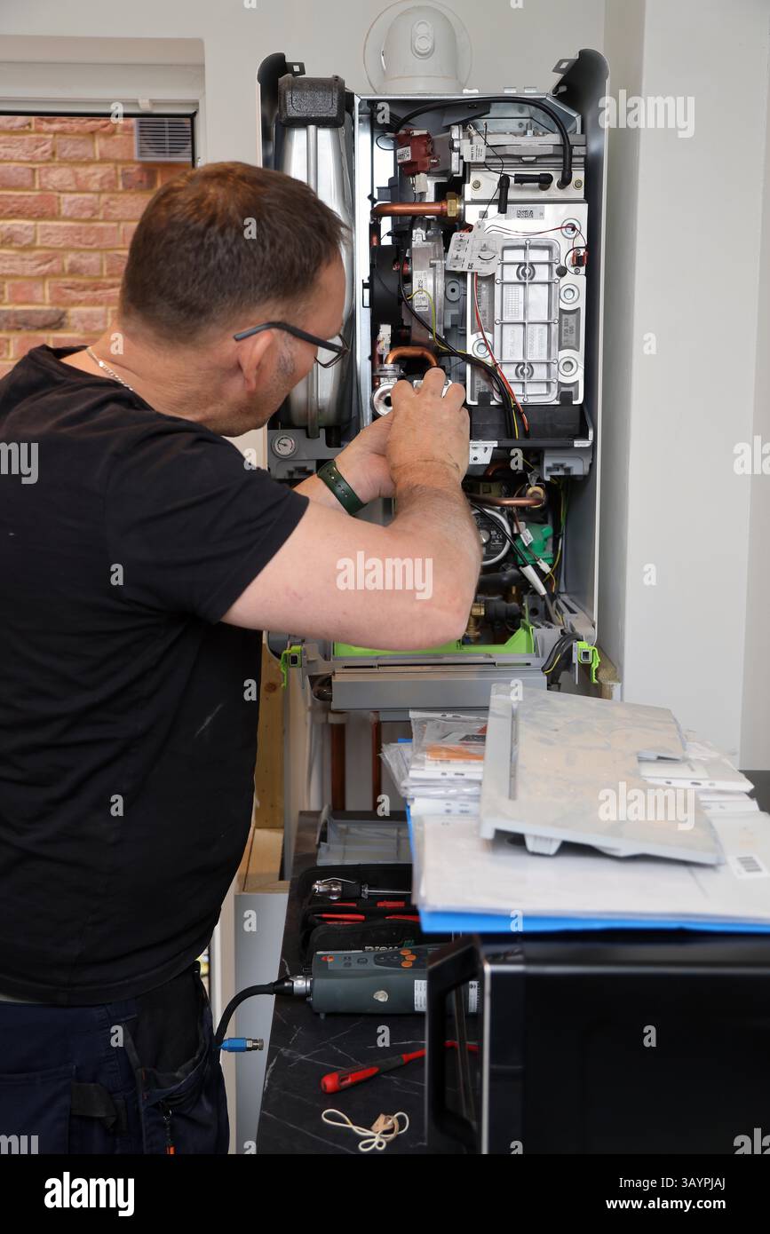 Servicing a modern Worcester gas combi boiler Stock Photo - Alamy
