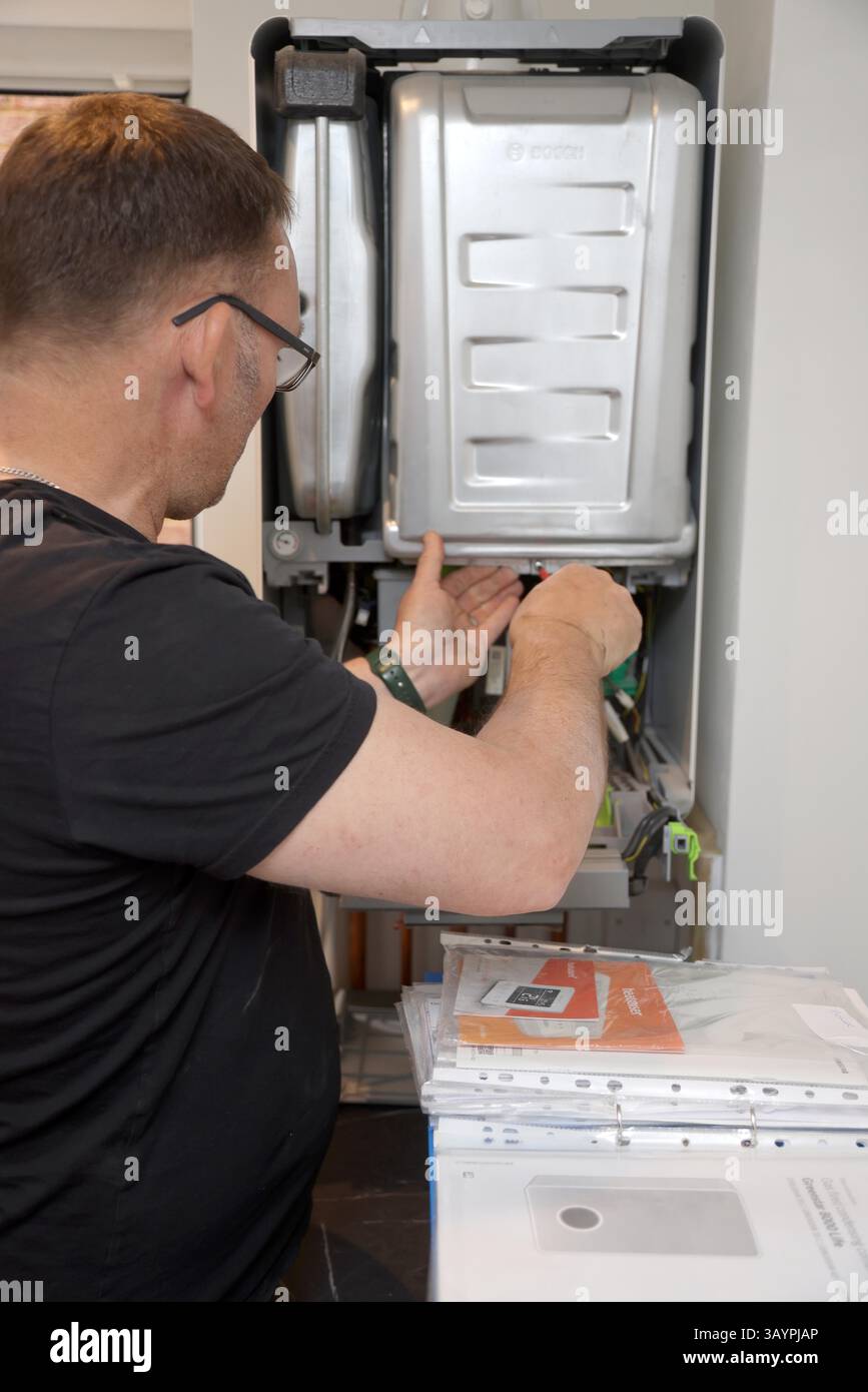 Servicing a modern Worcester gas combi boiler Stock Photo - Alamy