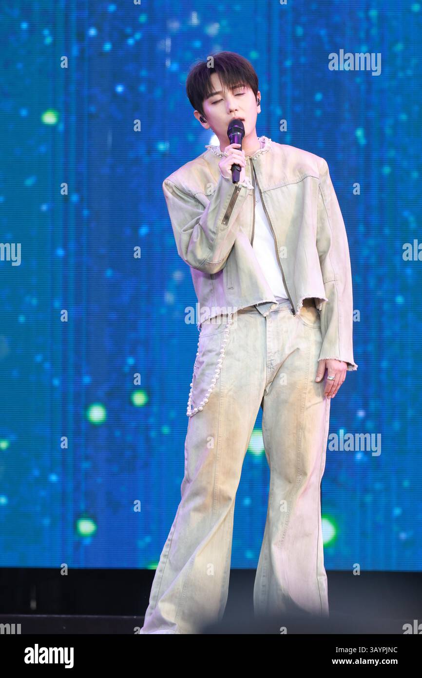 Chinese singer Zhao Yongxin sings at a music festival in Chengdu City ...