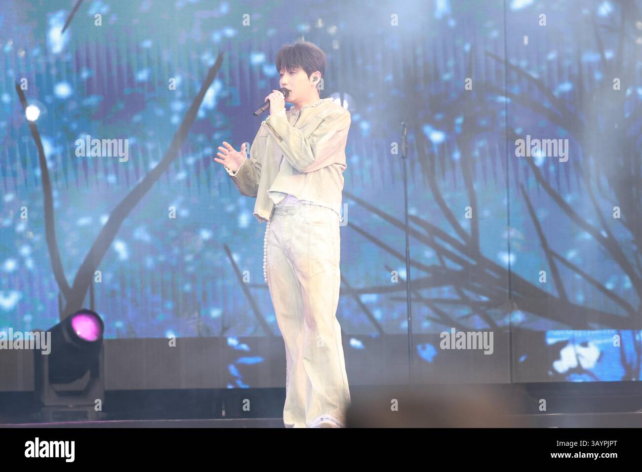 Chinese singer Zhao Yongxin sings at a music festival in Chengdu City ...