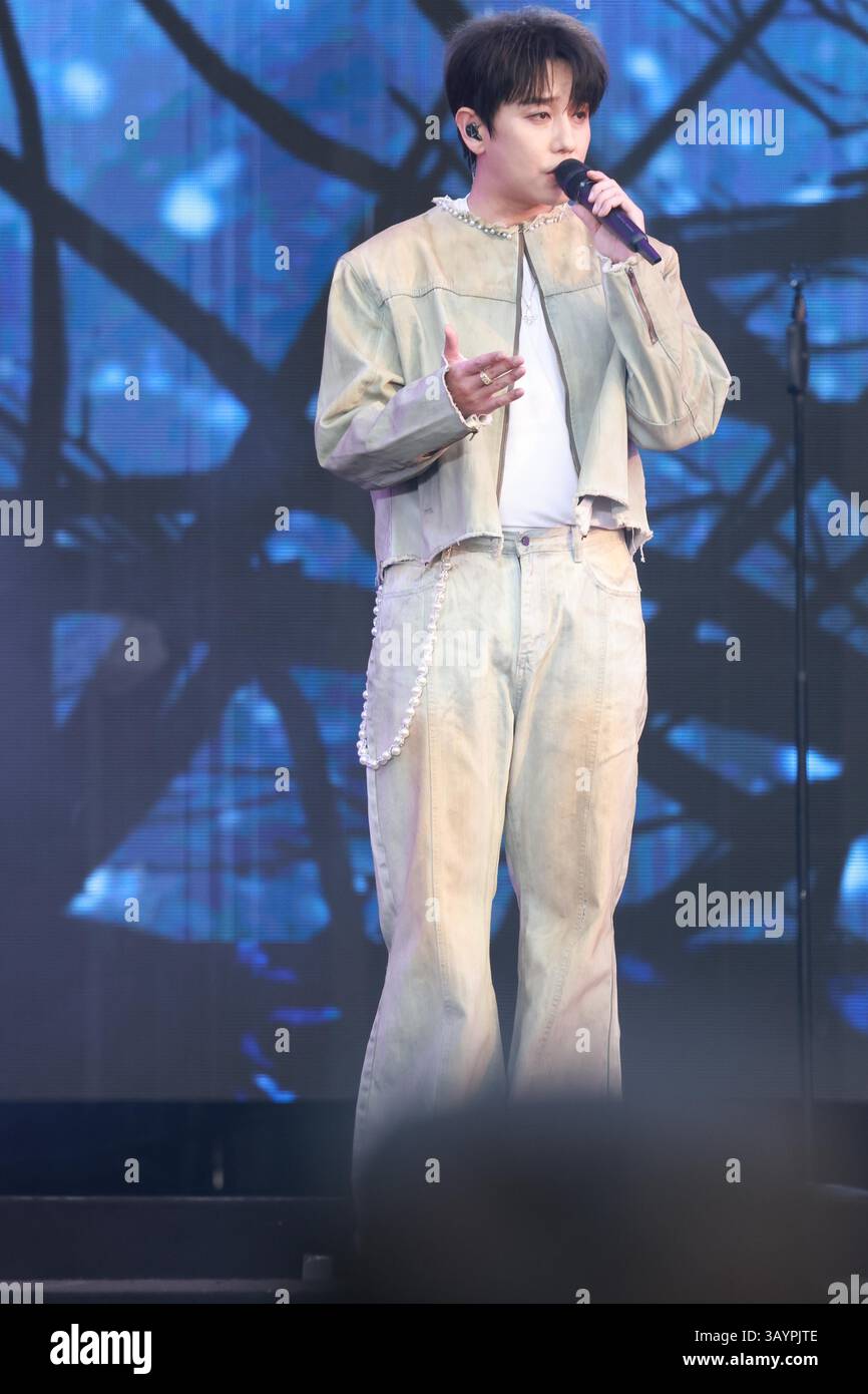 Chinese singer Zhao Yongxin sings at a music festival in Chengdu City ...