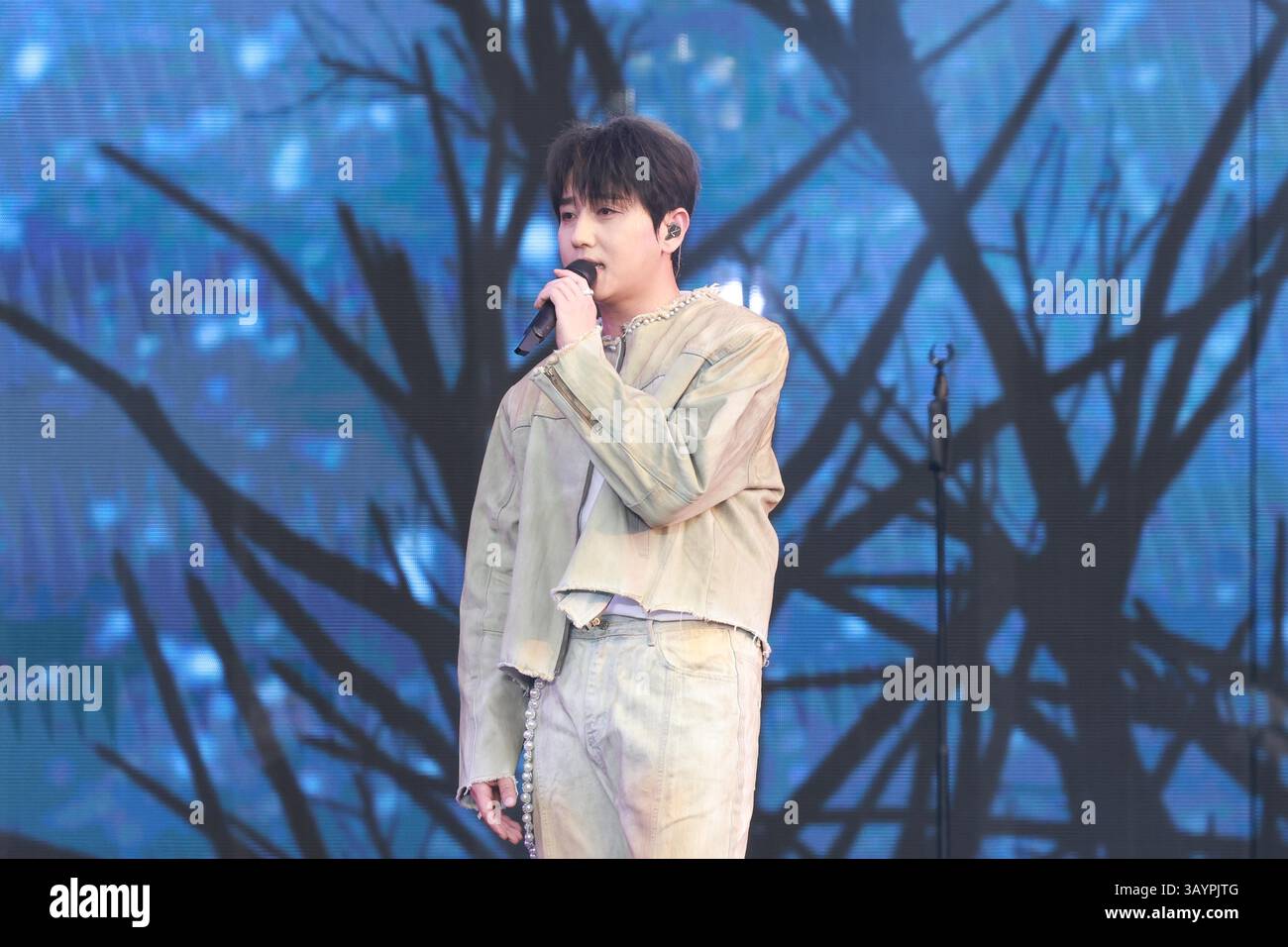 Chinese singer Zhao Yongxin sings at a music festival in Chengdu City ...