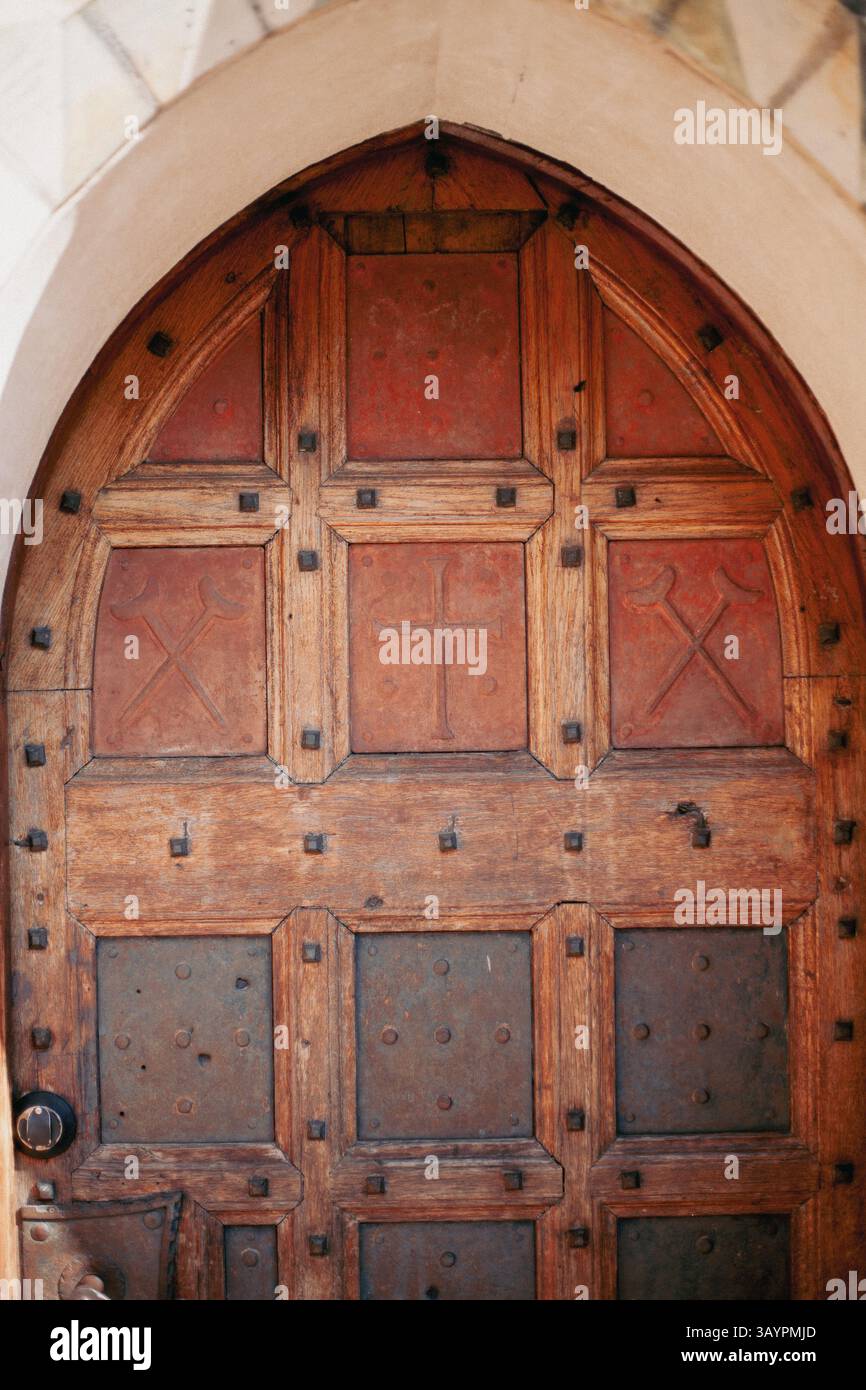 An elaborately crafted wooden door that beautifully highlights medieval ...