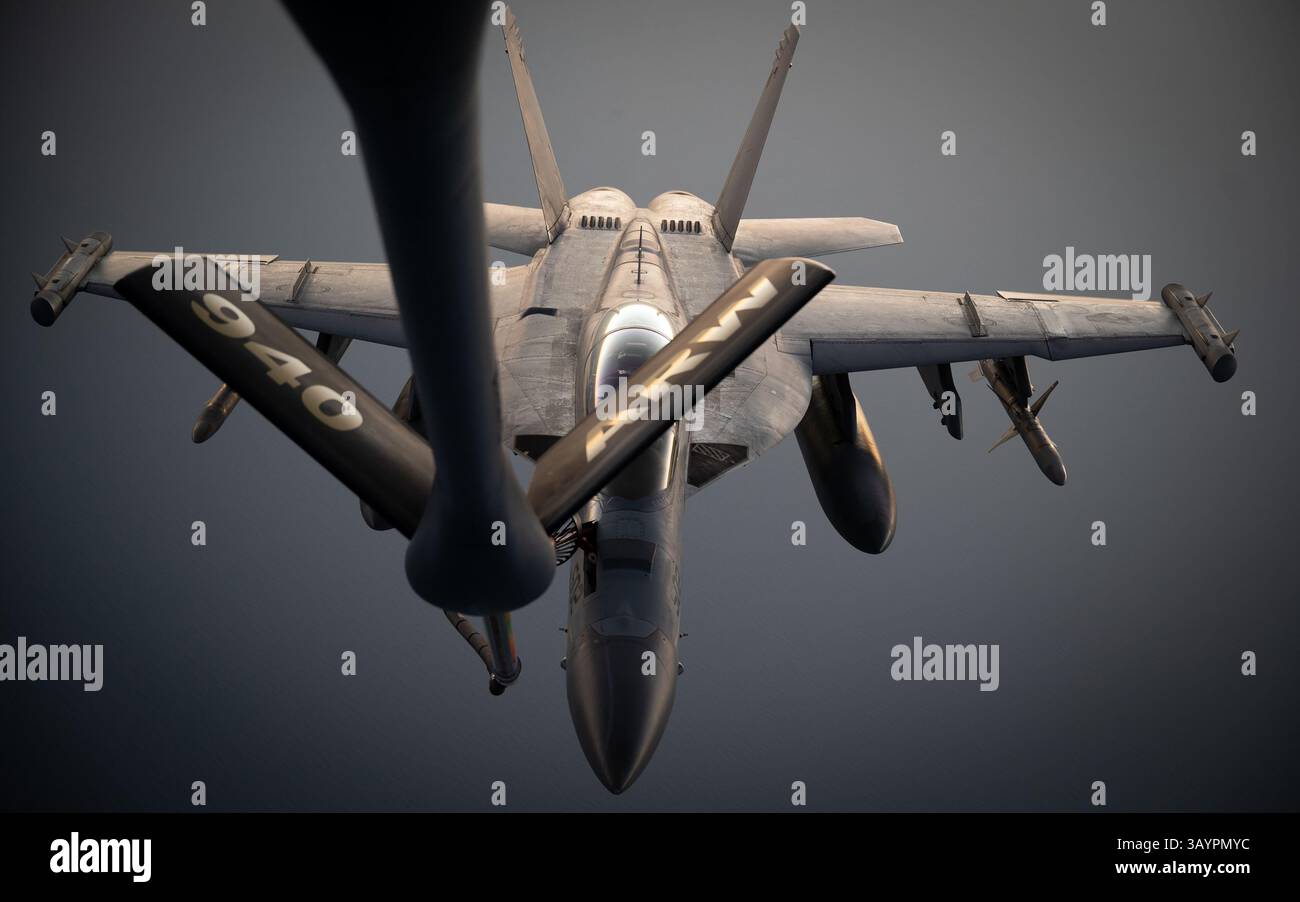 A U.S. Navy EA-18G Growler prepares to refuel from a U.S. Air Force KC ...