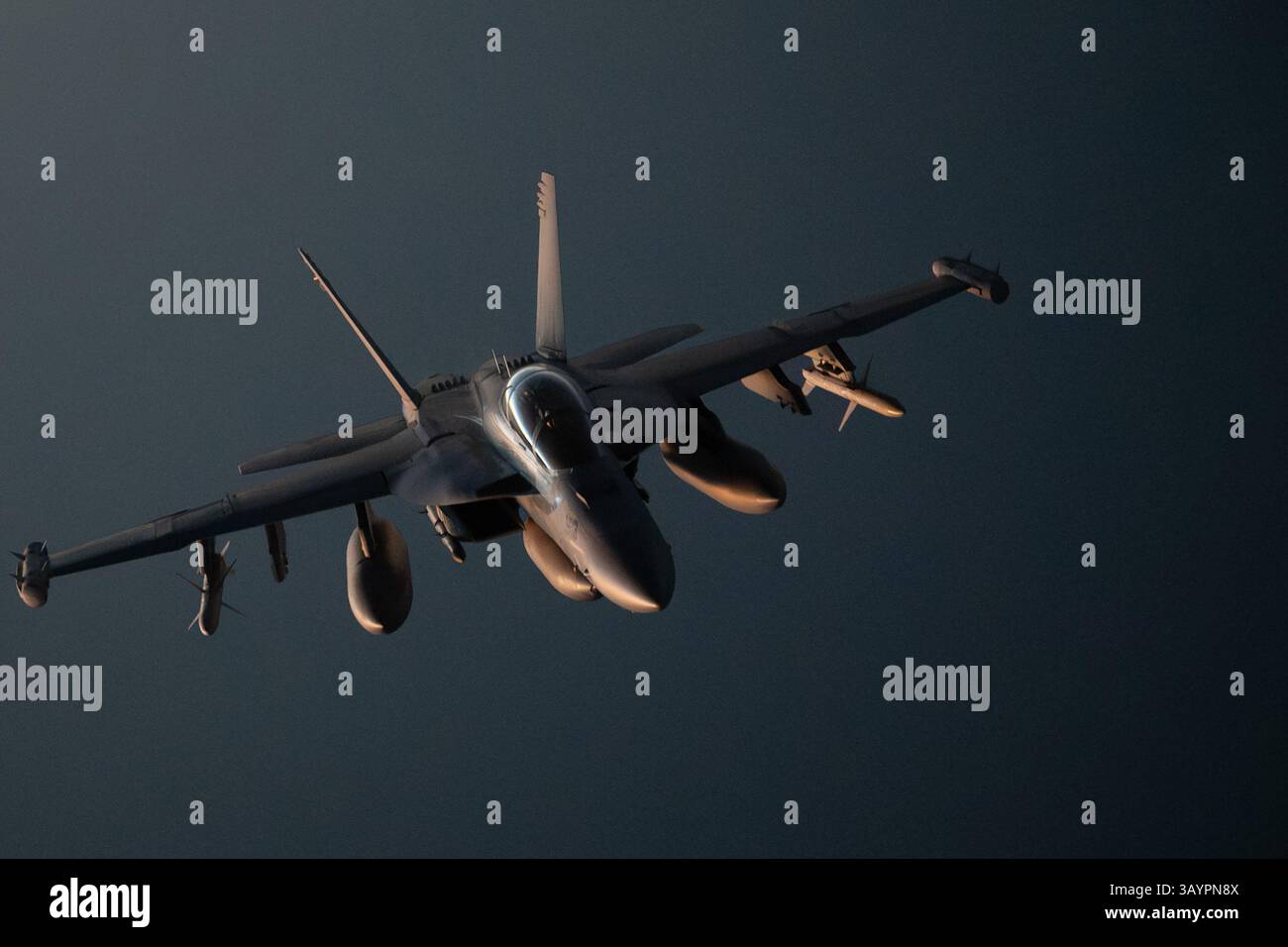 A U.S. Navy EA-18G Growler flies over the U.S. Central Command area of ...