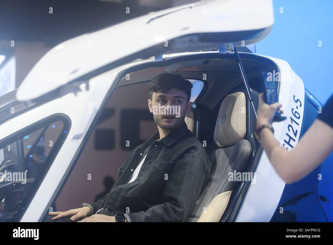 SHANGHAI, CHINA - APRIL 23, 2025 - Foreign visitors are viewing an ...