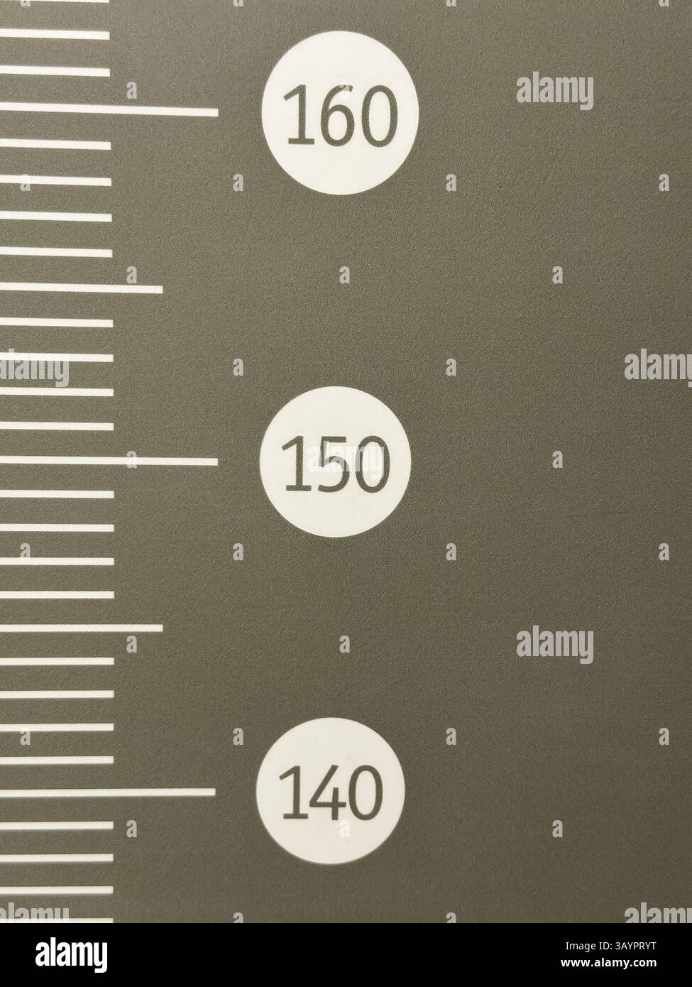 Close up of a height chart with markings at 140cm, 150cm, and 160cm. Illustrate growth ...