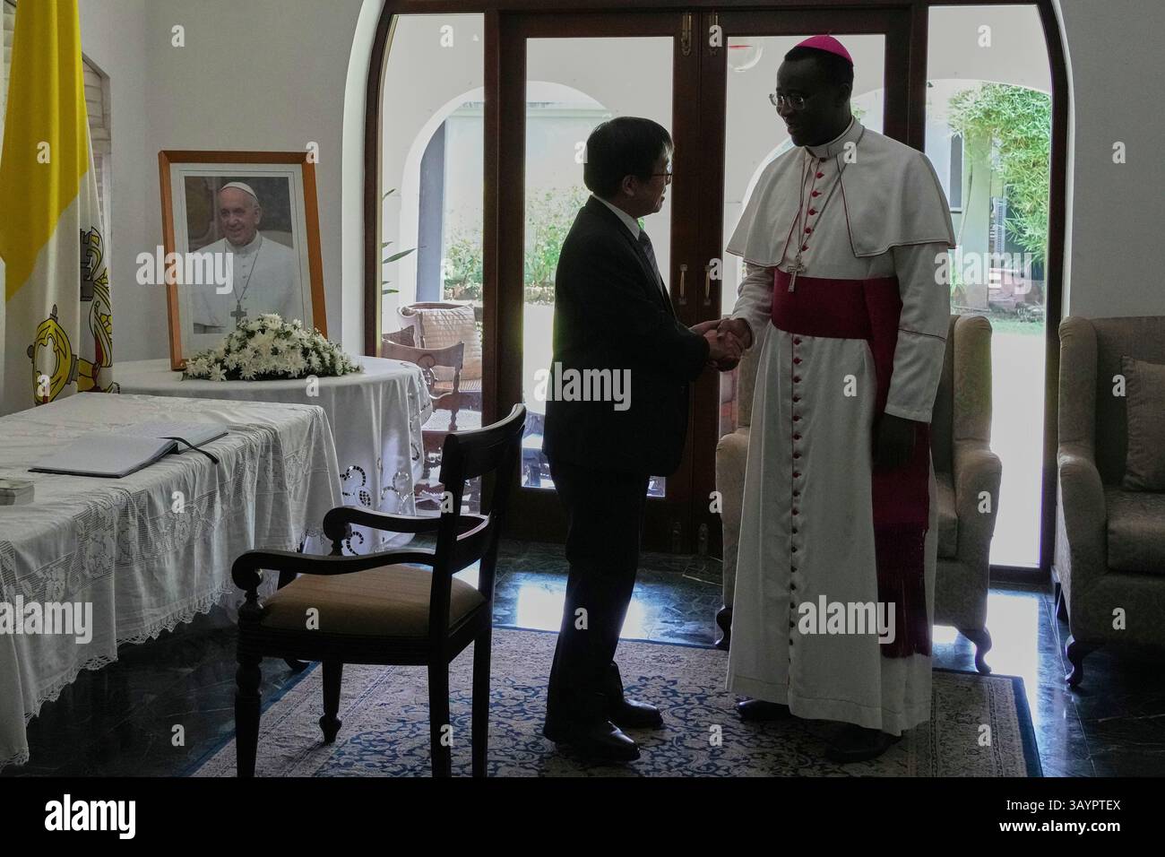 Apostolic Nuncio to Sri Lanka Archbishop Brian Udaigwe, right, shakes ...