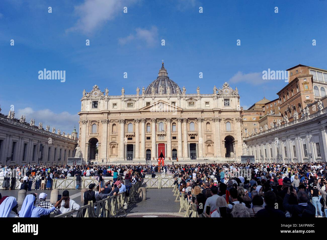 Thousands of people watch the arrival of the coffin of Pope Francis I at St. Peter's Basilica ...