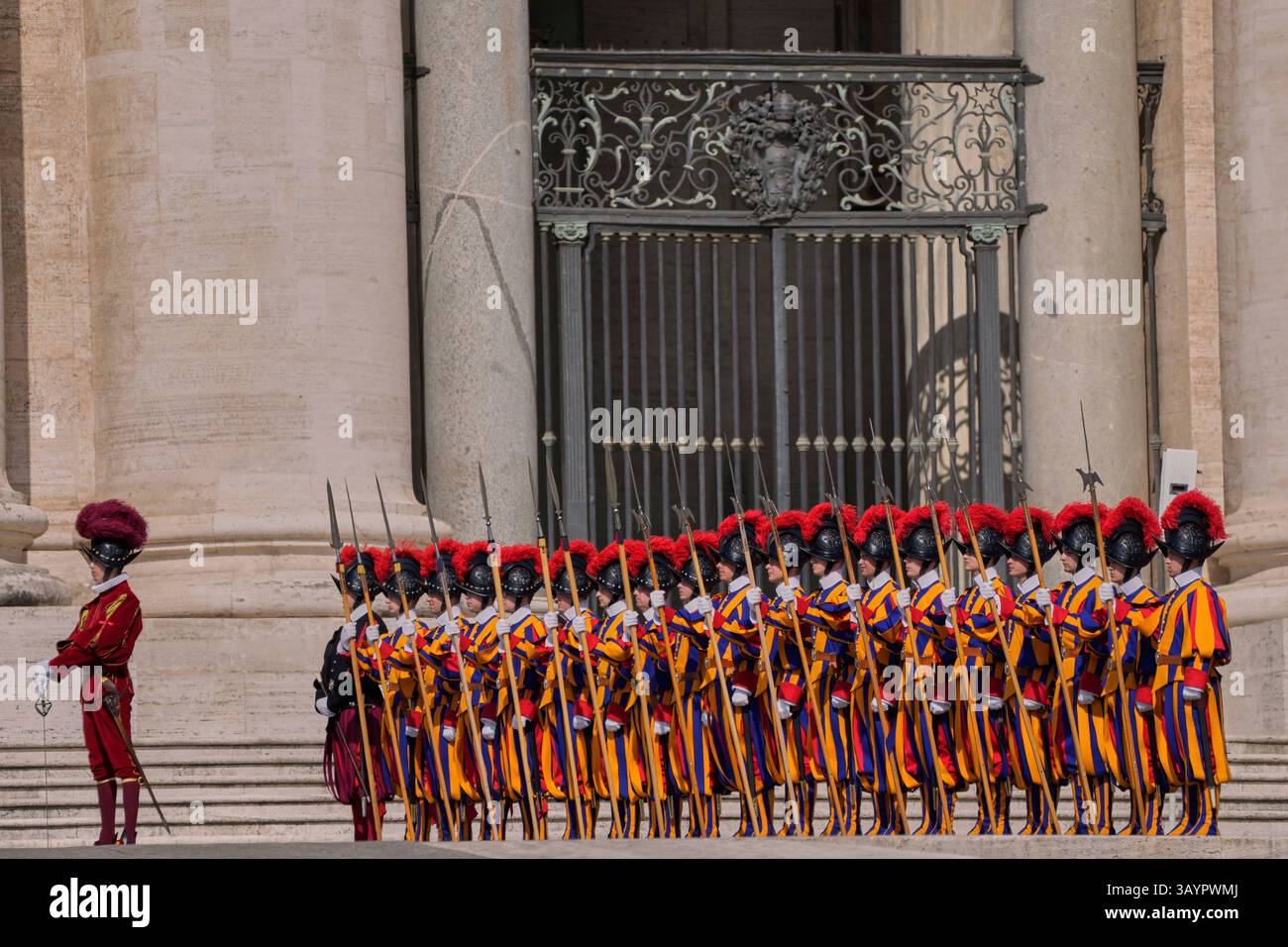 Pontifical Swiss guards stand in formation in St. Peter's Square as ...