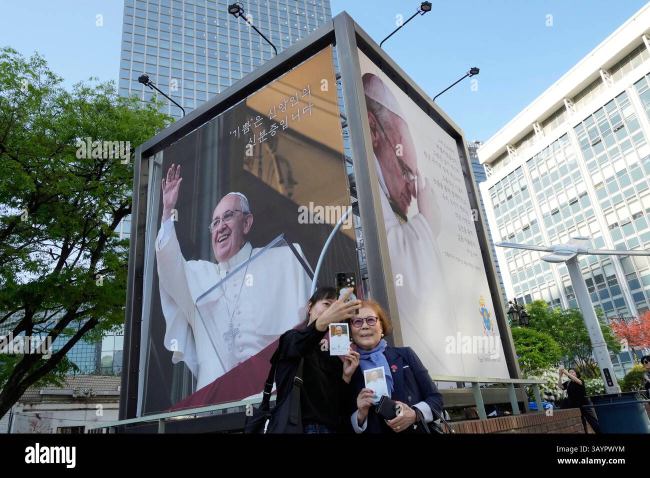 South Korean Kim Seung-hoe, right, and her daughter Baek Seung-joo take ...