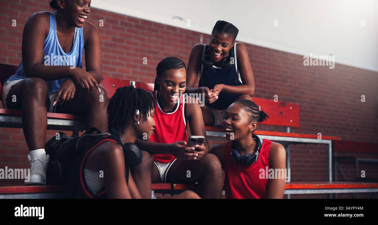 Sports, athlete and group with mobile, laughing and watching game on ...