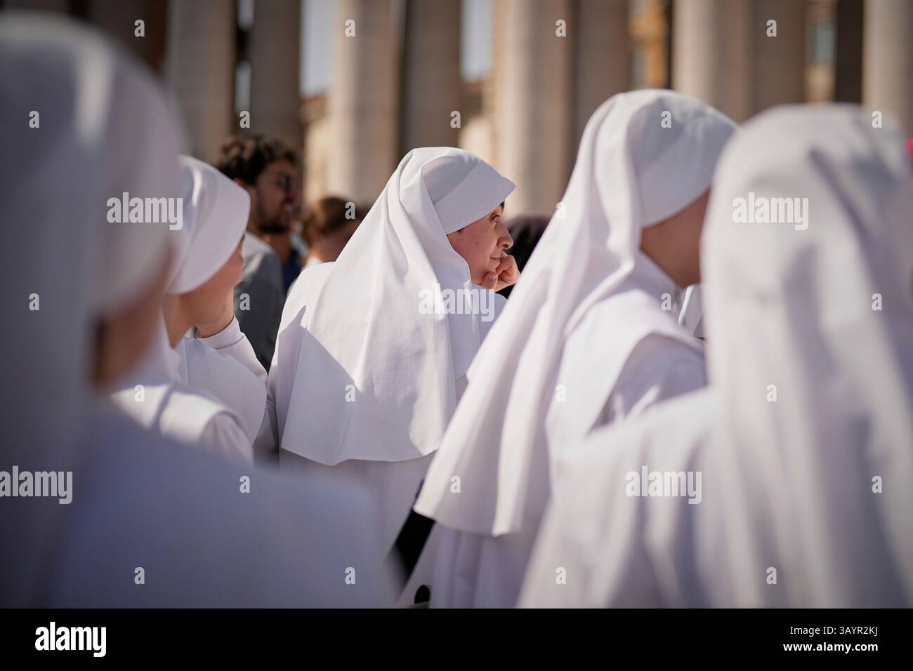 Nuns wait in St. Peter's Square to pay their respect to the late Pope ...