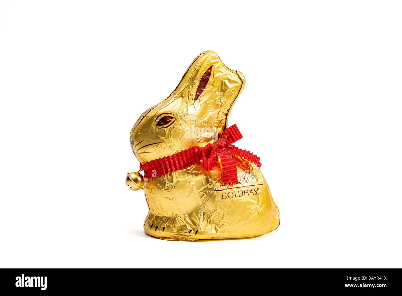 Germany Berlin April 21, 2025. Chocolate bunny in a gold wrapper with a ...