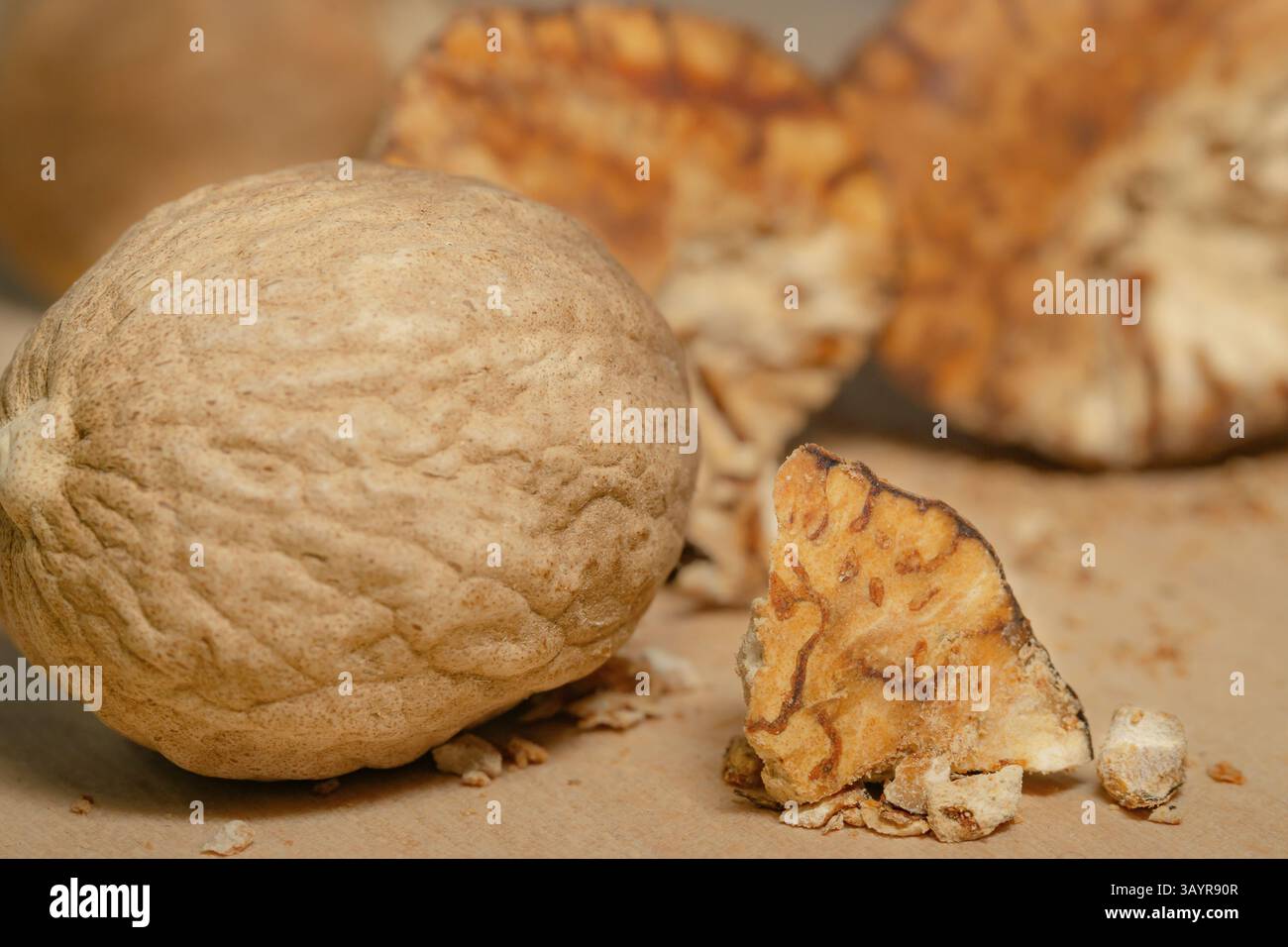 A close-up of whole and sliced nutmeg Stock Photo - Alamy