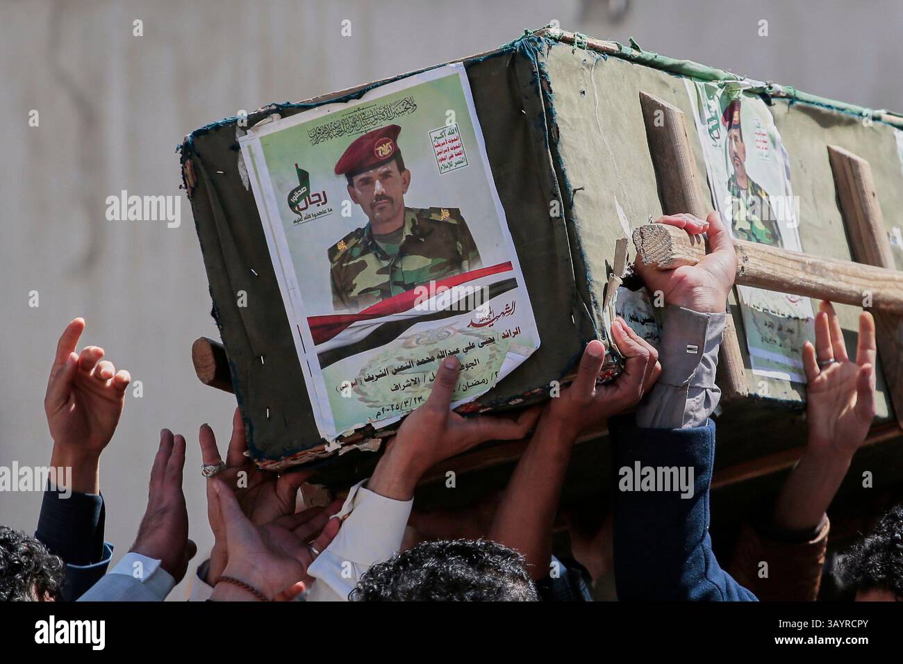 Yemenis carry the coffin of army major Yehya Ali who was killed in U.S. airstrikes at Al Mashhad ...
