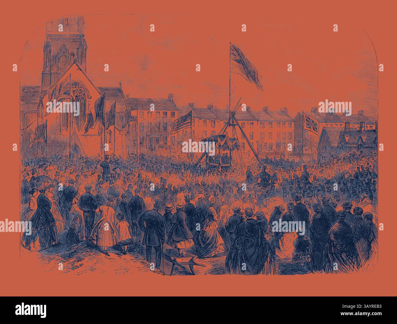 A large crowd gathers in a town square, celebrating an event with flags ...