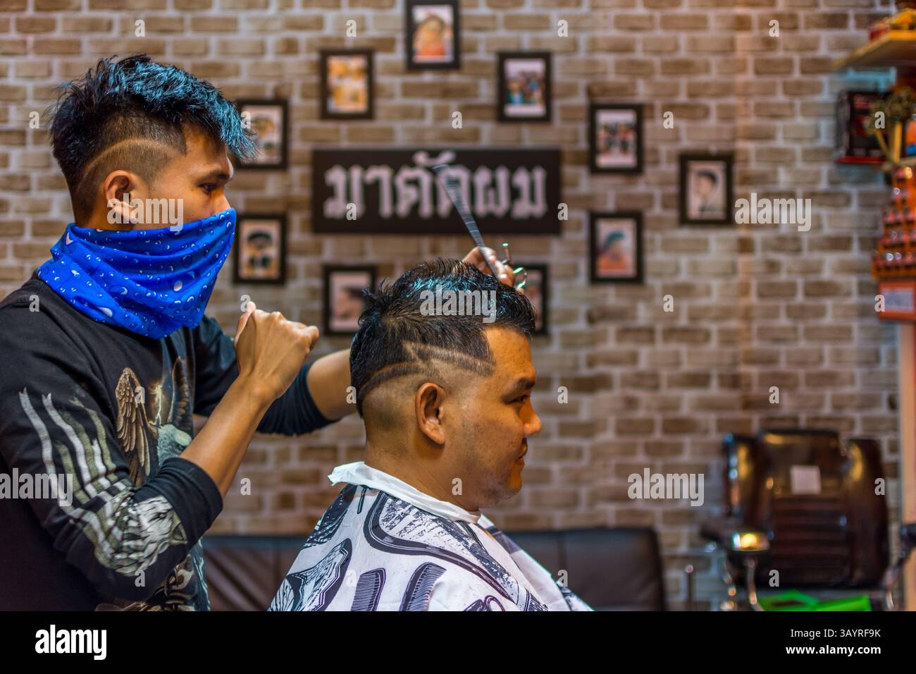 Bangkok, Thailand - January 14, 2017 : Unidentified Thai man barber ...