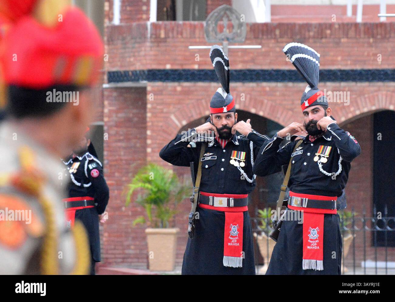 FILE- Pakistan Rangers' soldiers face Indian Border Security Force ...