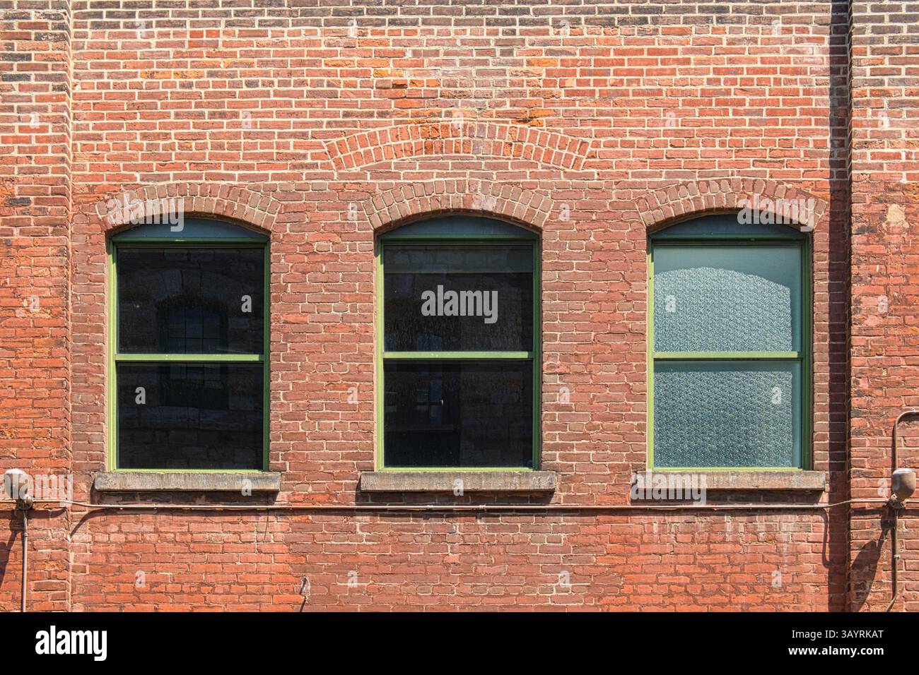 Red Brick Elevation and Three Sash Windows Stock Photo - Alamy