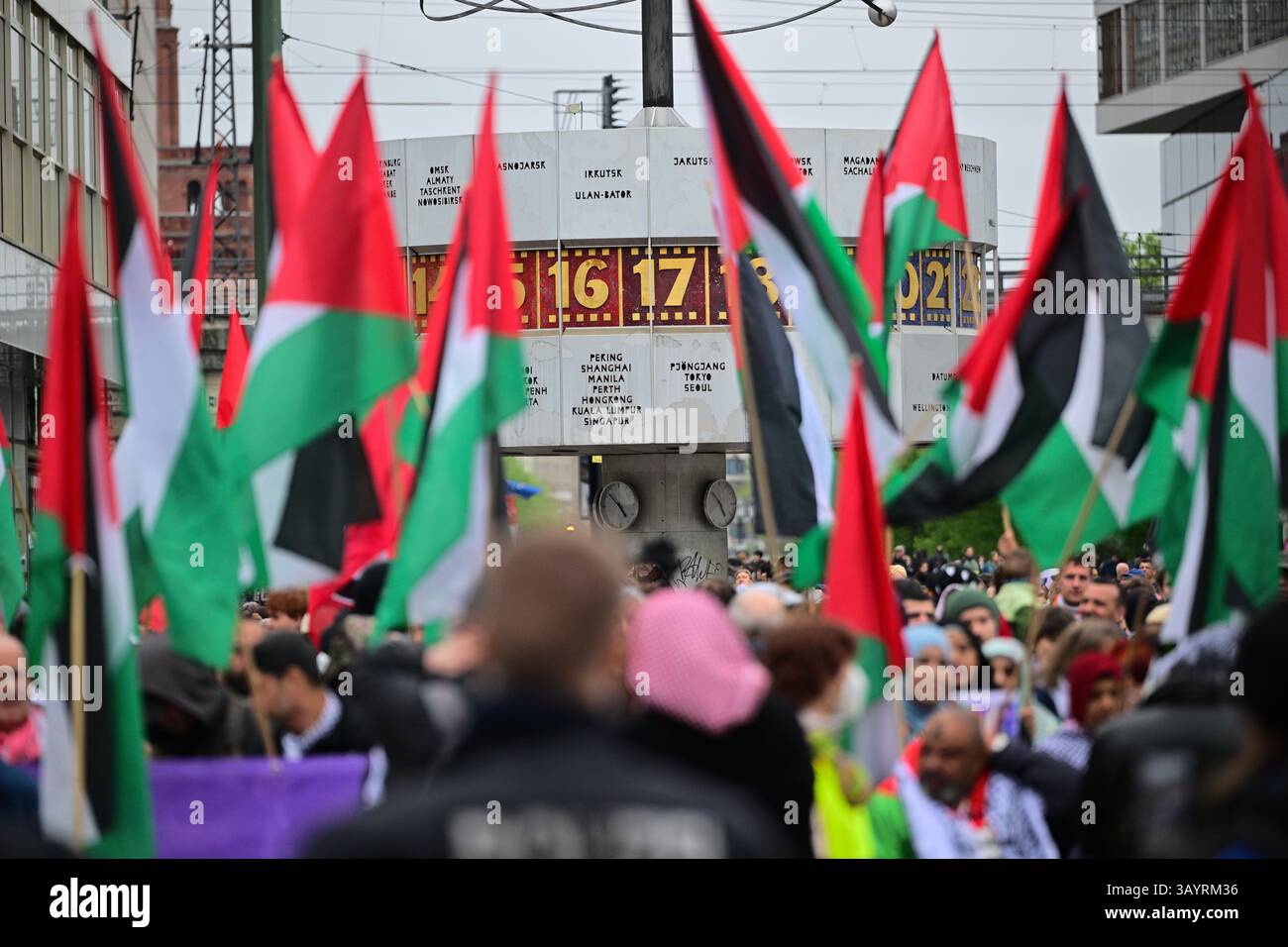 Berlin, Germany. 18th Apr, 2025. Palestinian flags are waved during a ...