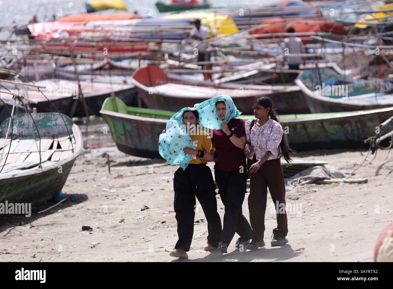 Prayagraj, India. 23 April 2025, people brave heat wave conditions ...