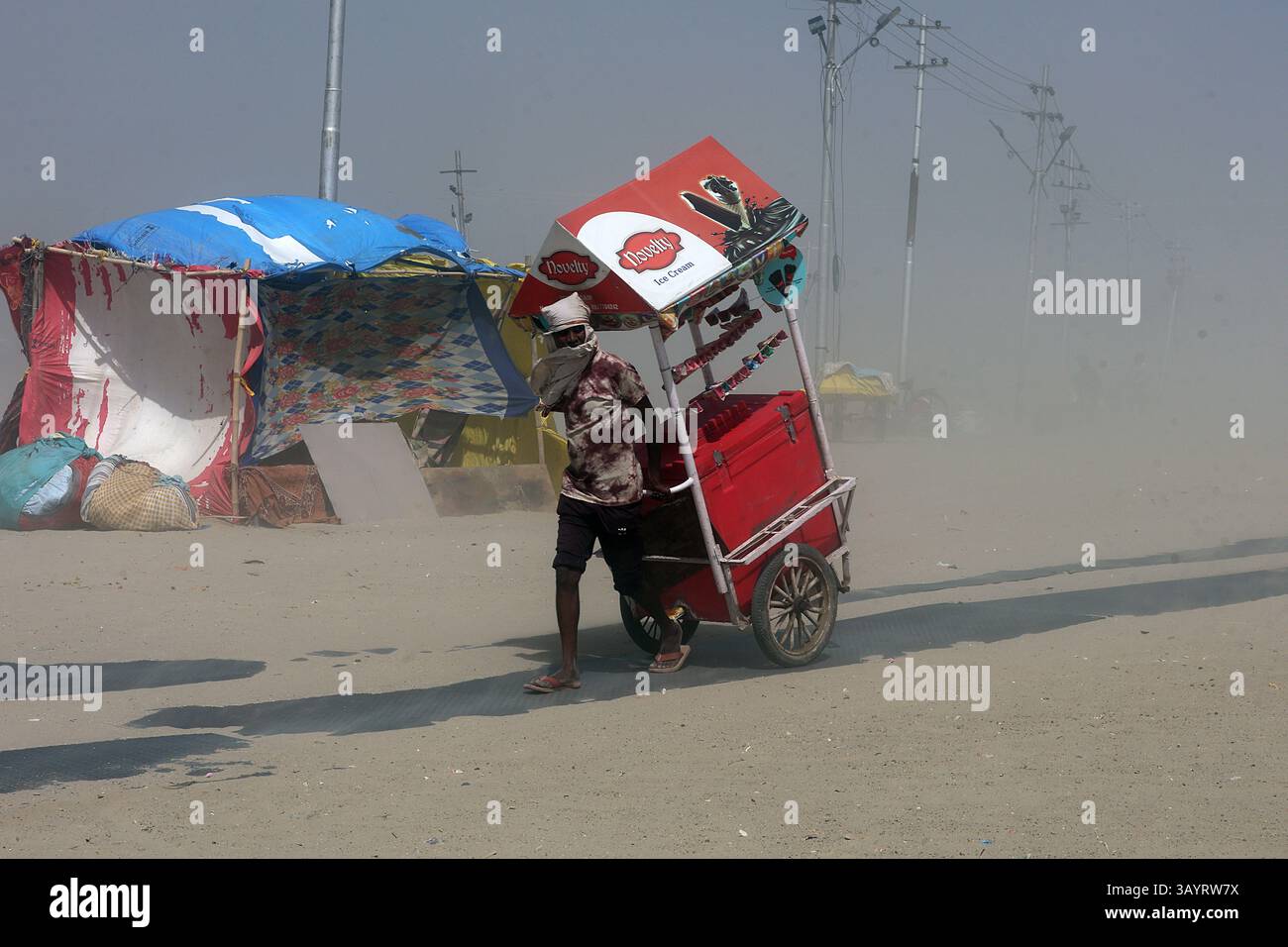 Prayagraj, India. 23 April 2025, people brave heat wave conditions ...