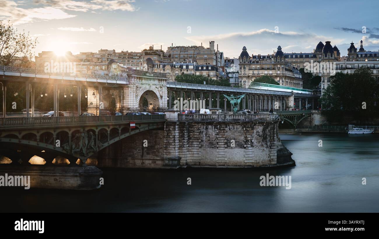 famous bridge Pont de Bir-Hakeim near Eiffel tower with a subway train ...