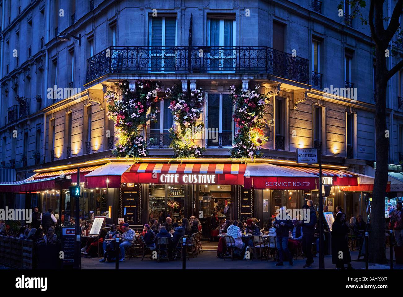Café Gustave restaurant with typical with a flower facade, french ...