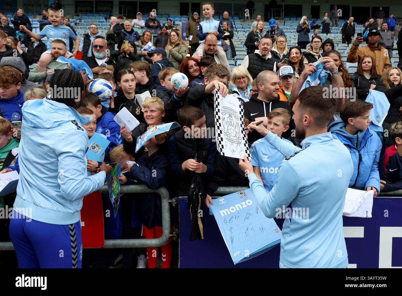 Coventry City players sign autographs after a training session at the ...