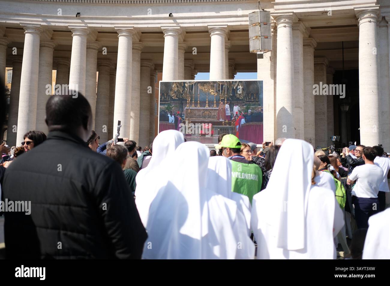 Vatican City, Vatican. 23rd April 2025. Nuns watch a giant screen ...