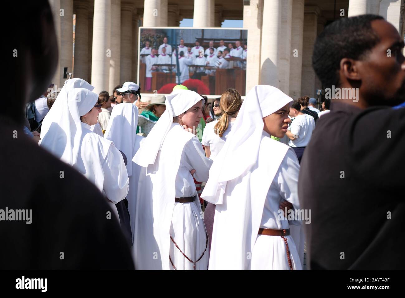 Vatican City, Vatican. 23rd April 2025. Nuns watch a giant screen ...