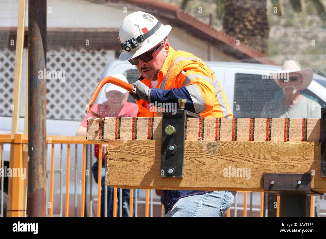 Contestants compete at the hand sawing part of the Mining Competition ...