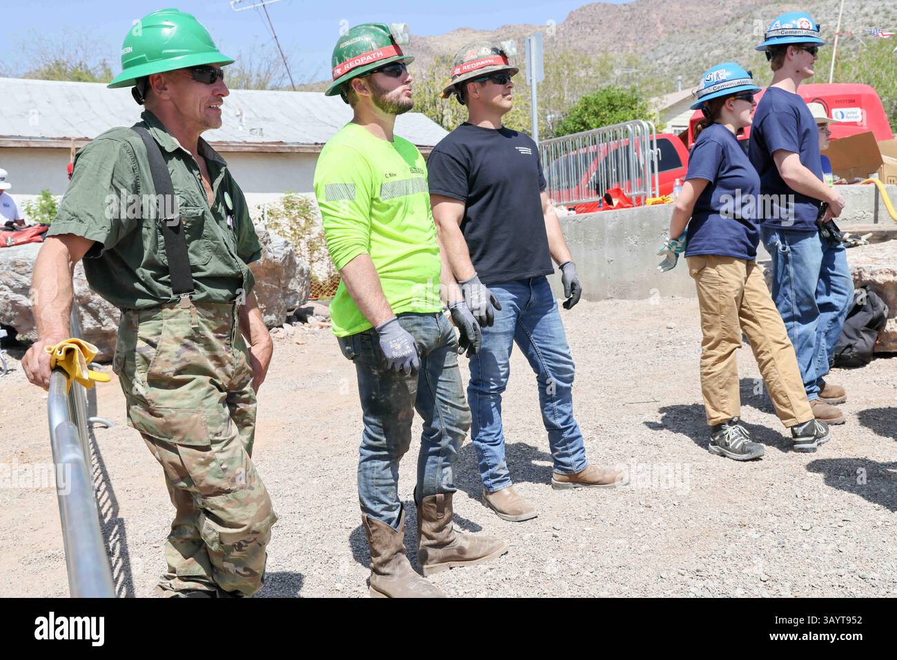 Contestants compete at the hand sawing part of the Mining Competition ...