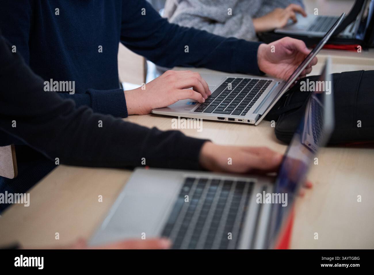 Pupils use the school computers to take notes during class.Photo ...