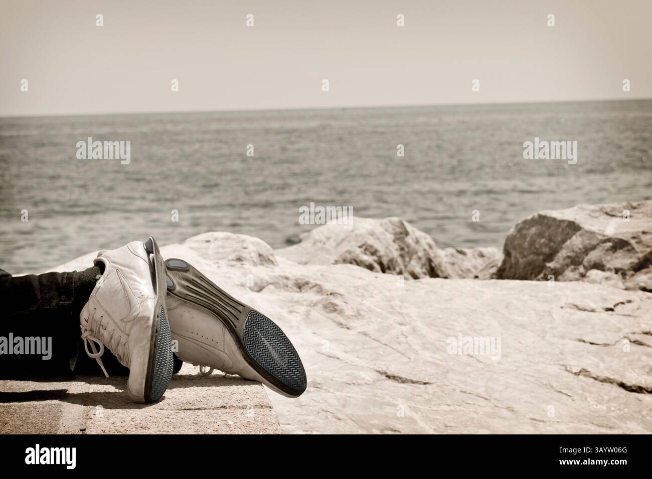 Man sunbathing on the beach hi-res stock photography and images - Alamy