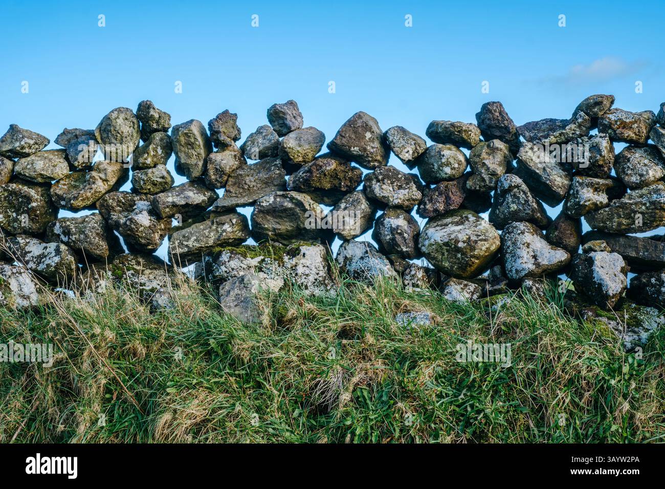 Traditional Volcanic Stone Wall Boundary Against Clear Blue Sky, Rural ...